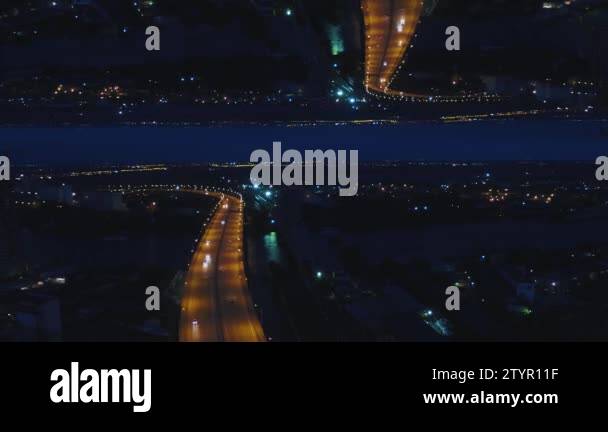 Moscow at night with urban architecture and river across the bridge ...