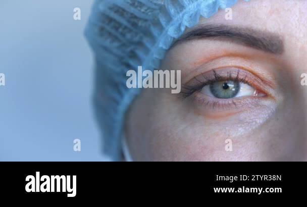 Portrait girl (woman) in a medical uniform. A mask on her face is ...