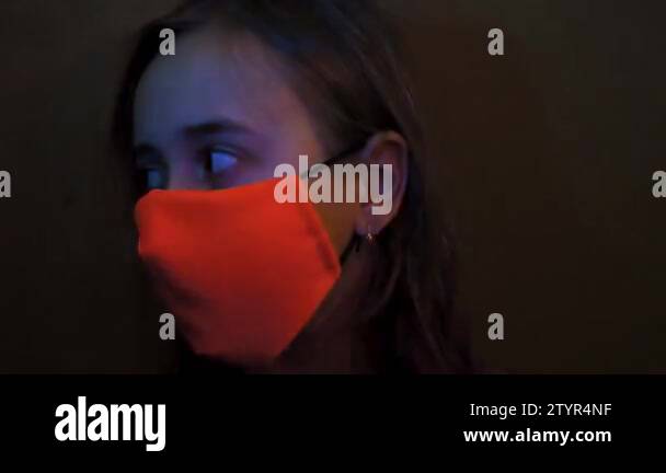 A teenager on a background of flashing lights of a siren. Coronavirus ...