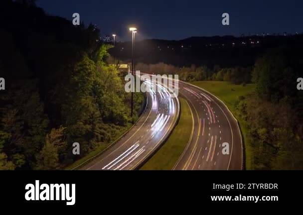 Zoom out long exposure time lapse of light trails headlights and tail ...