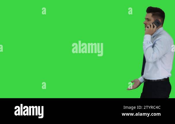Angry businessman yelling at phone on a Green Screen, Chroma Key Stock ...