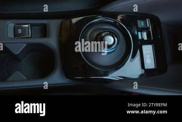 The driver in the car presses the auto parking button. Smart technology ...