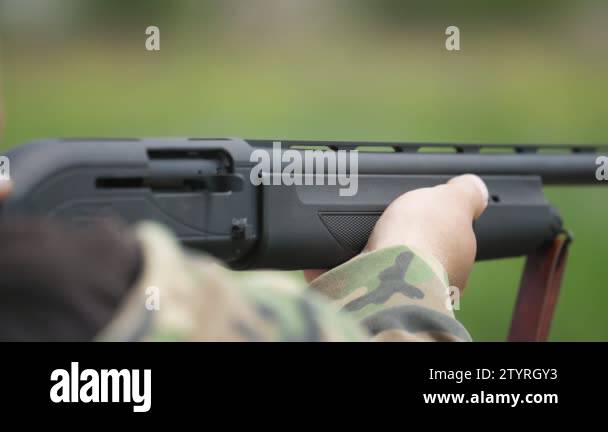 Black rifle shooting and a cartridge case moving out breaching lock in ...