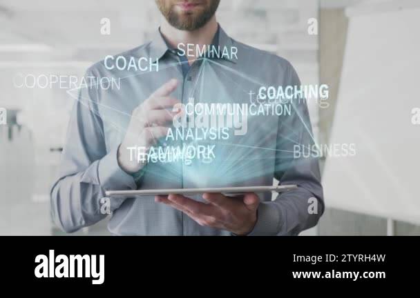 coaching, training, teaching, meeting, business word cloud made as hologram used on tablet by ...