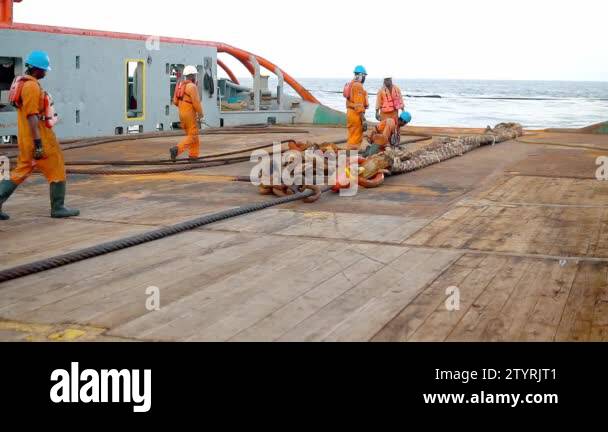 Anchor-handling Tug Supply AHTS vessel crew preparing vessel Stock Video Footage - Alamy
