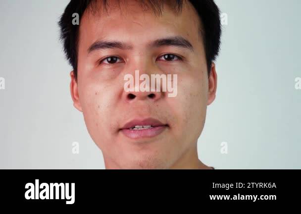 Close up portrait of tired Asian man expressing drowsy and yawn over ...