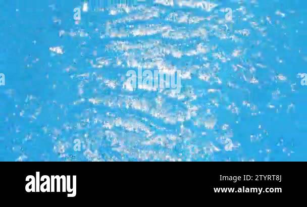 water ripples and sun hightlight in swimming pool, blue background, 4k ...