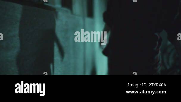 Zombie woman walking outside the building at night. Woman ...