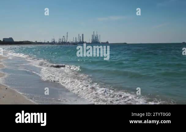 Construction of oil production towers in the Persian Gulf. Desert ...