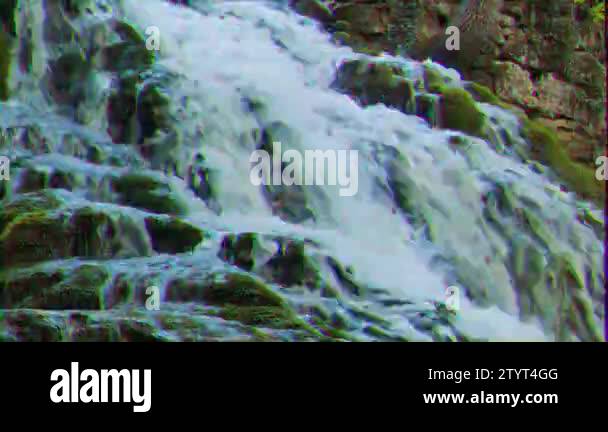 Glitch effect. Waterfall flows from Yusupov lake. Mountain Crimea ...