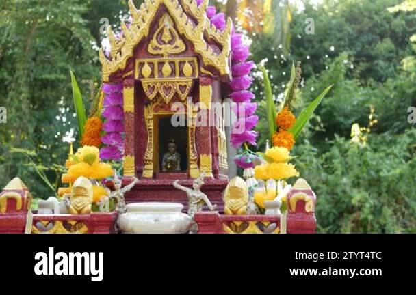 Wooden miniature guardian spirit house. Small buddhist temple shrine ...