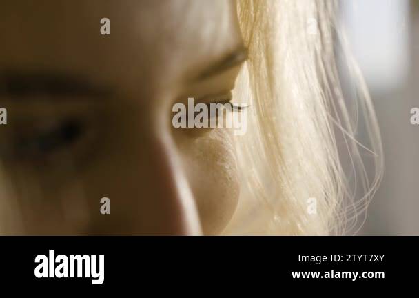 Beautiful blonde woman face close up. Action. Close-up of the face of a ...