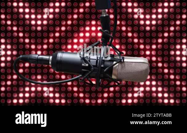 Animation of microphone over multiple rows of red glowing lights of ...