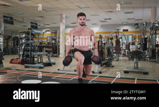 Concentrated great looking bodybuilding man with a perfect body have a ...