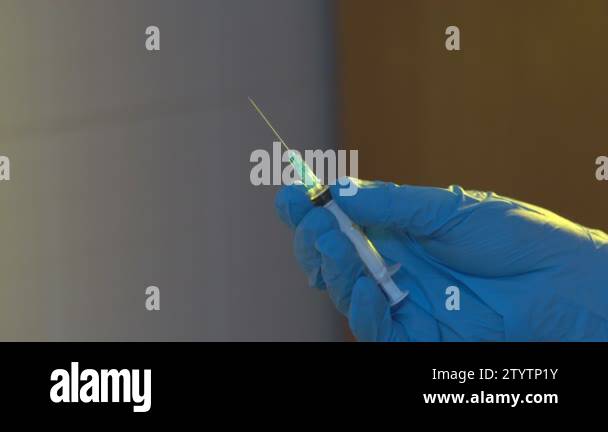 Syringe disposable medical. The medicine is squeezed out of the syringe ...