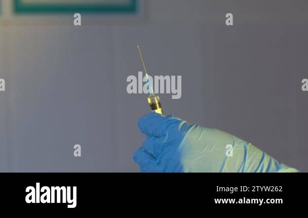 Syringe disposable medical. The medicine is squeezed out of the syringe ...