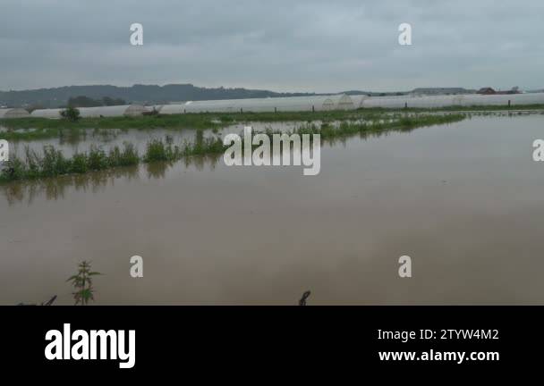 Rural farm flooding featuring farm house, on dry flooded fields Stock ...