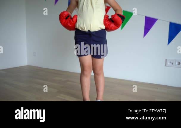 Caucasian girl with boxing gloves. Face with bruise. Gimbal camera ...