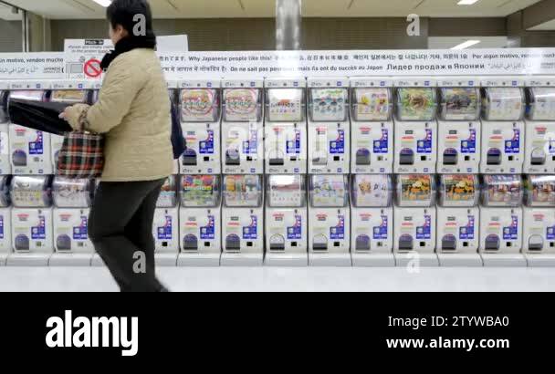 TOKYO, JAPAN - CIRCA MARCH, 2017: Woman in front of Japanese capsule ...