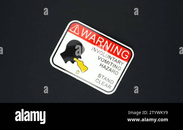 WARNING INVOLUNTARY VOMITING HAZARD warning sign word text Stock Video ...