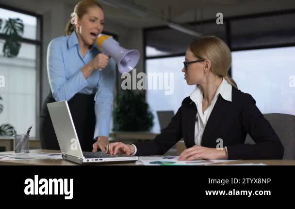 Female boss screaming with megaphone at colleague, authoritarian ...