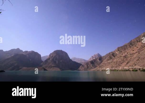 Glitch effect. Moon over mountain lake. Tajikistan, IskanderKul ...