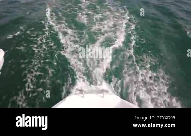A view of the motor of the boat and the ocean. Camera On A Floating ...