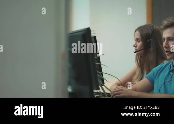 Young man throwing headset in call center. Nervous worker throwing ...