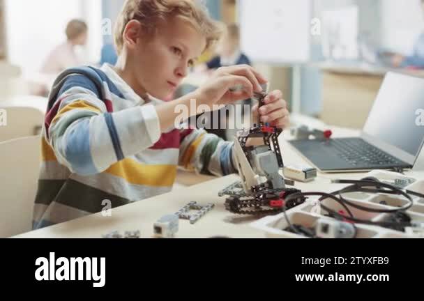 Schoolboy Builds / Constructs Small Robot and Uses Laptop to Program ...