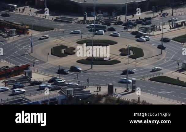 circular traffic in the city. cars, buses and motorcycles move in a ...
