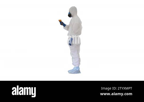 Doctor wearing protective clothes using infrared forehead thermometer ...