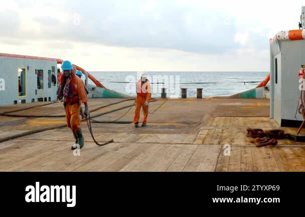 Anchor-handling Tug Supply AHTS vessel crew preparing vessel Stock Video Footage - Alamy