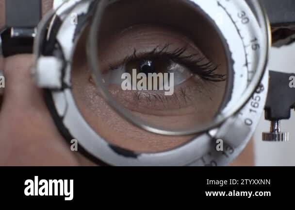 Woman eye with changed lens in phoropter, visual acuity test, cornea ...