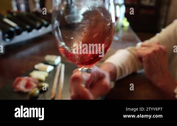 Wine test, crystal glass, red wine, cheese, bar counter background ...