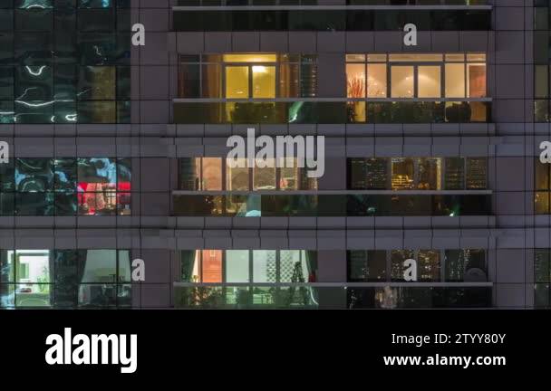 Night view of exterior apartment building timelapse. High rise ...