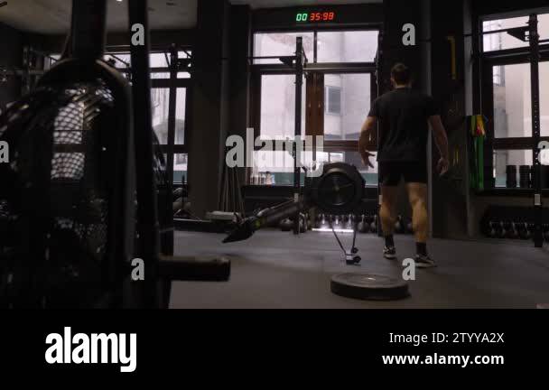 Closeup back view shoot of adult muscular athletic bodybuilder walking ...