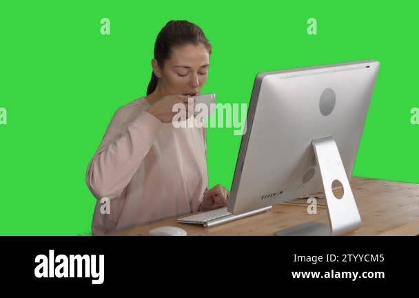 Young woman with computer and cafe on a Green Screen, Chroma Key Stock ...