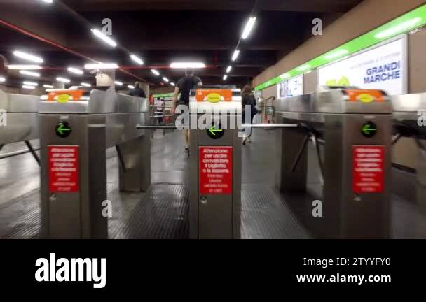 LONDON - JUNE, 2018: Man entering subway station with Oyster card. The ...