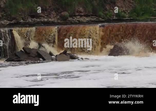 Sablinsky waterfalls. Little waterfall. The brown water of the ...