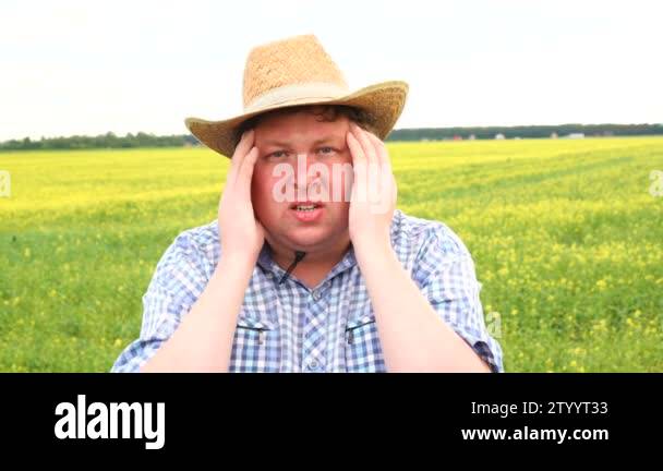Close-up sad young farmer with worried stressed face expression. Man in ...