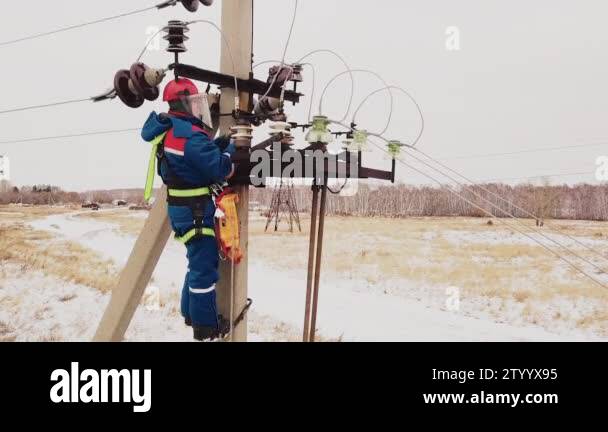 Repairman working at power line with voltage wires on station Stock ...