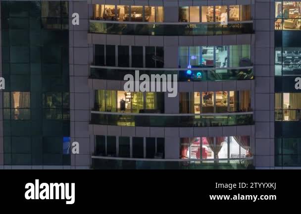 Night view of exterior apartment building timelapse. High rise ...