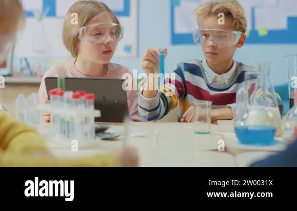 Elementary School Science Classroom: Smart Boy Mixes Chemicals in ...