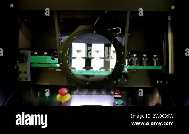 Quality Control vials for injection. Individual checks vial under a ...