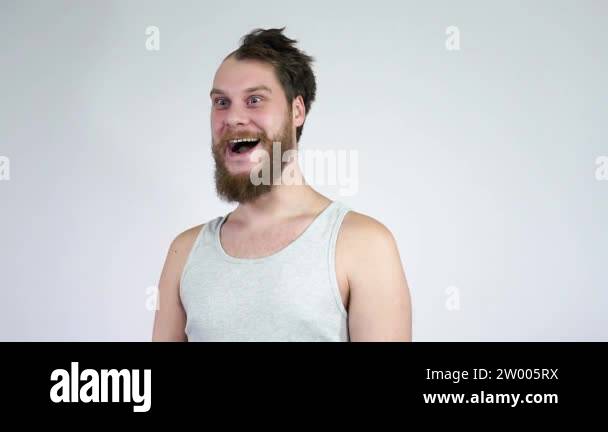 Crazy man with half shaved hair laughing at the camera.Before after ...