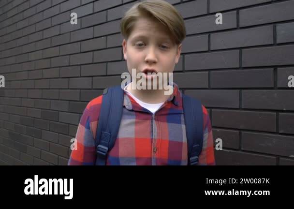 Teenage boy teasing, bullying into camera, provocation to fight, victim ...