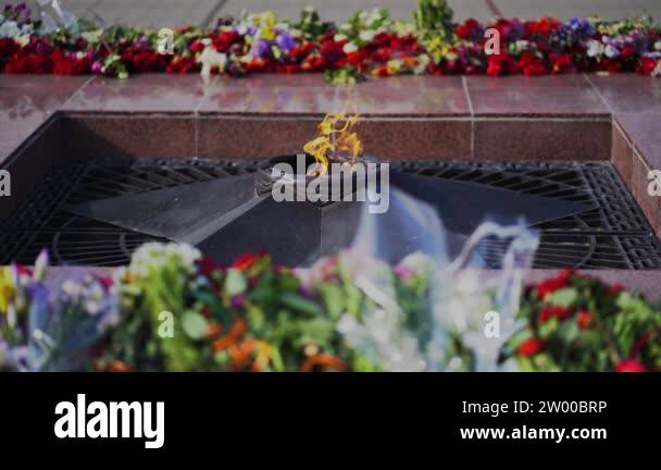 Eternal Flame monument with star and flowers at the Grave of Unknown ...