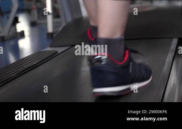 fitness club man engaged in walking. close-up of foot. strengthening ...