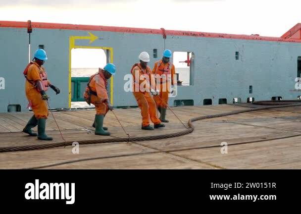 Anchor-handling Tug Supply AHTS vessel crew preparing vessel Stock Video Footage - Alamy