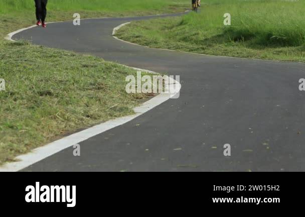 Road runner Male Legs Feet Running on Park Road. Exercising Concept ...